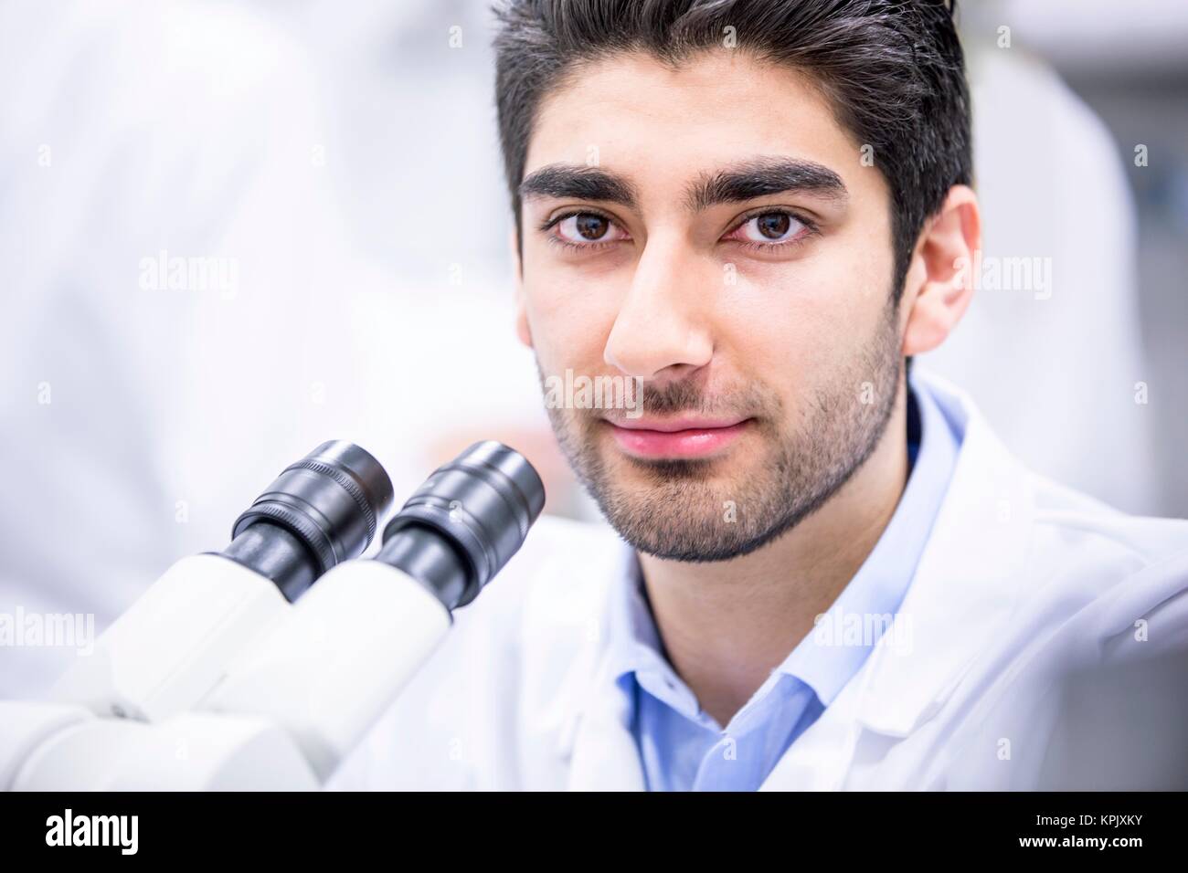 Male scientist with microscope, portrait Stock Photo - Alamy