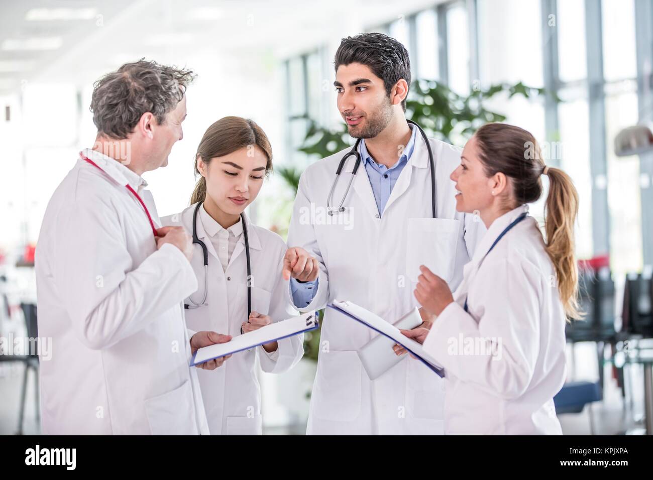 Medical colleagues with clip boards Stock Photo - Alamy