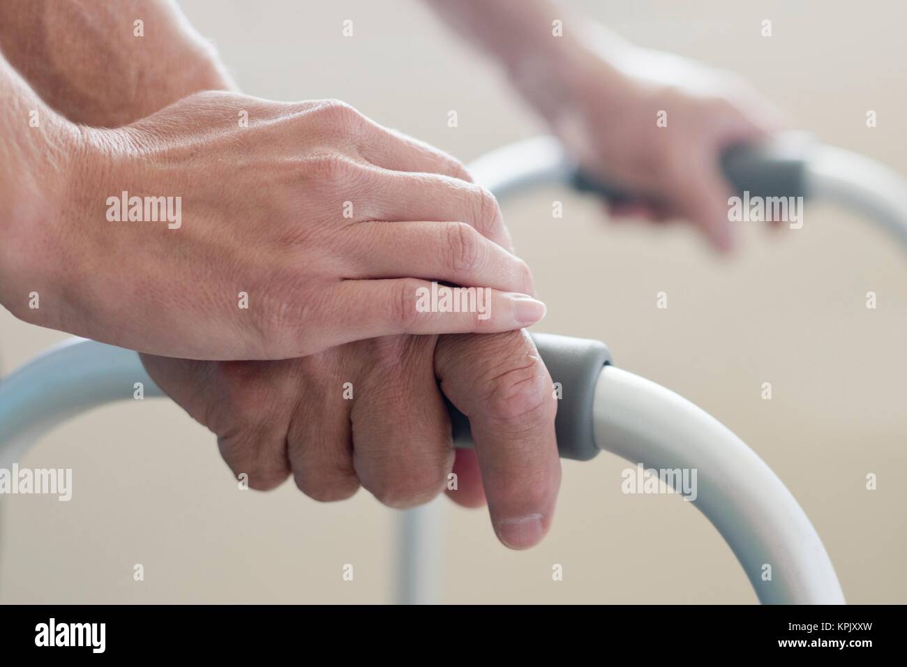 Patient using walking frame, close up Stock Photo - Alamy