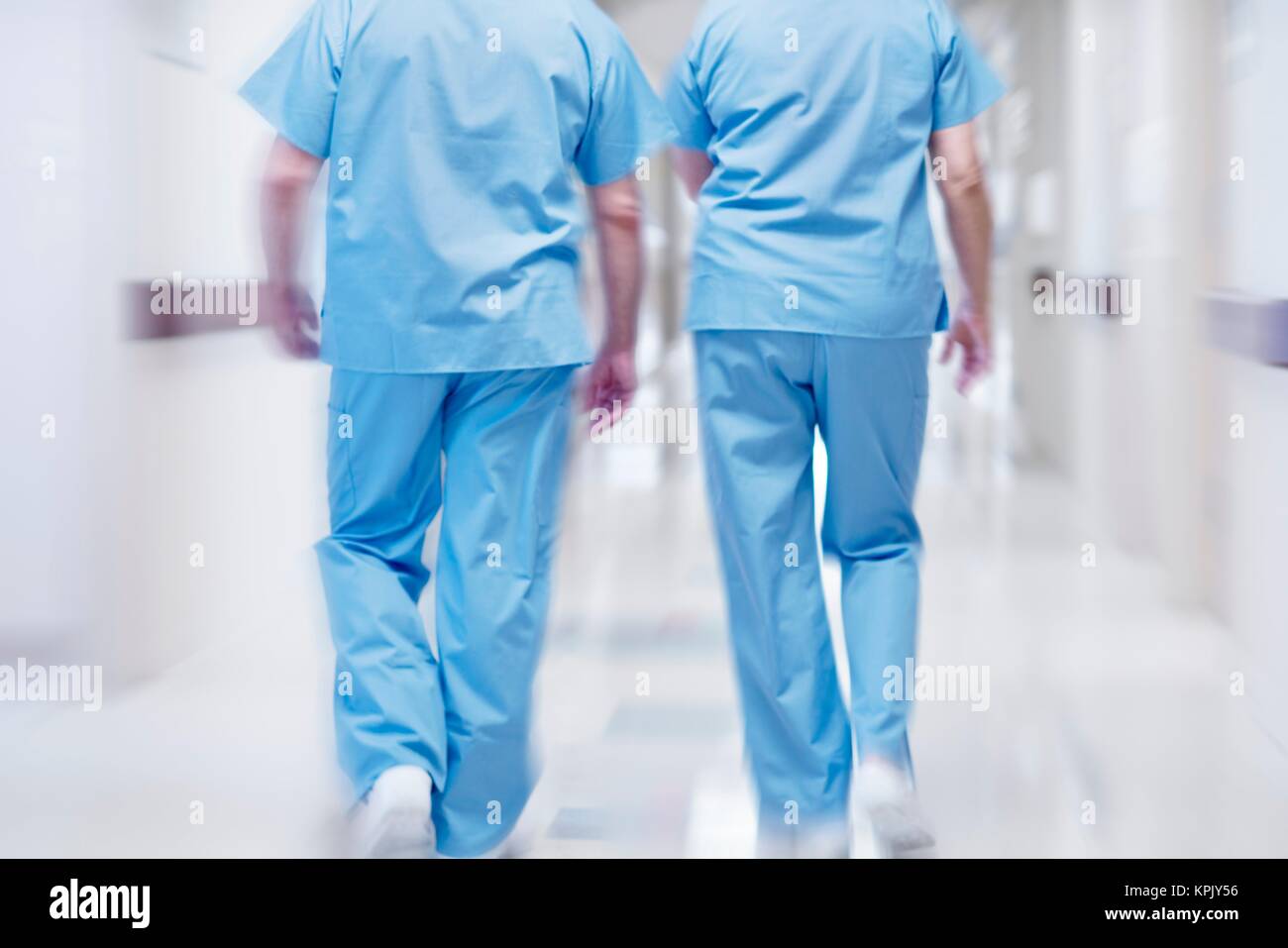 Two doctors wearing surgical scrubs, rear view Stock Photo - Alamy