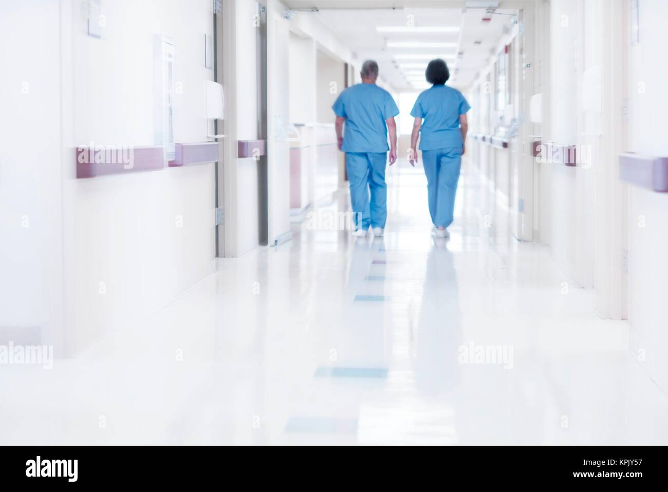 Two doctors wearing surgical scrubs, rear view Stock Photo - Alamy