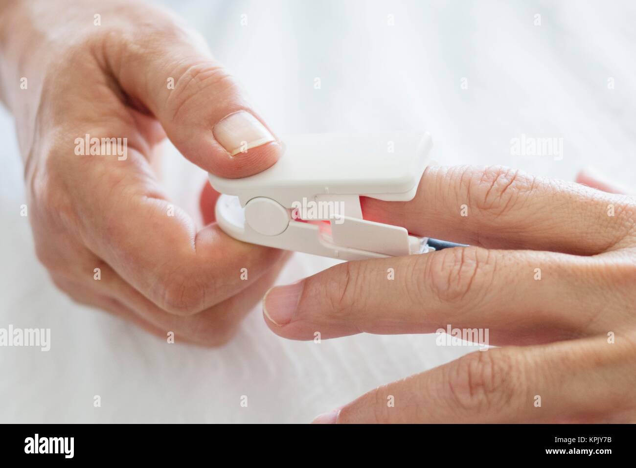 Mature man pulse oximeter hi-res stock photography and images - Alamy