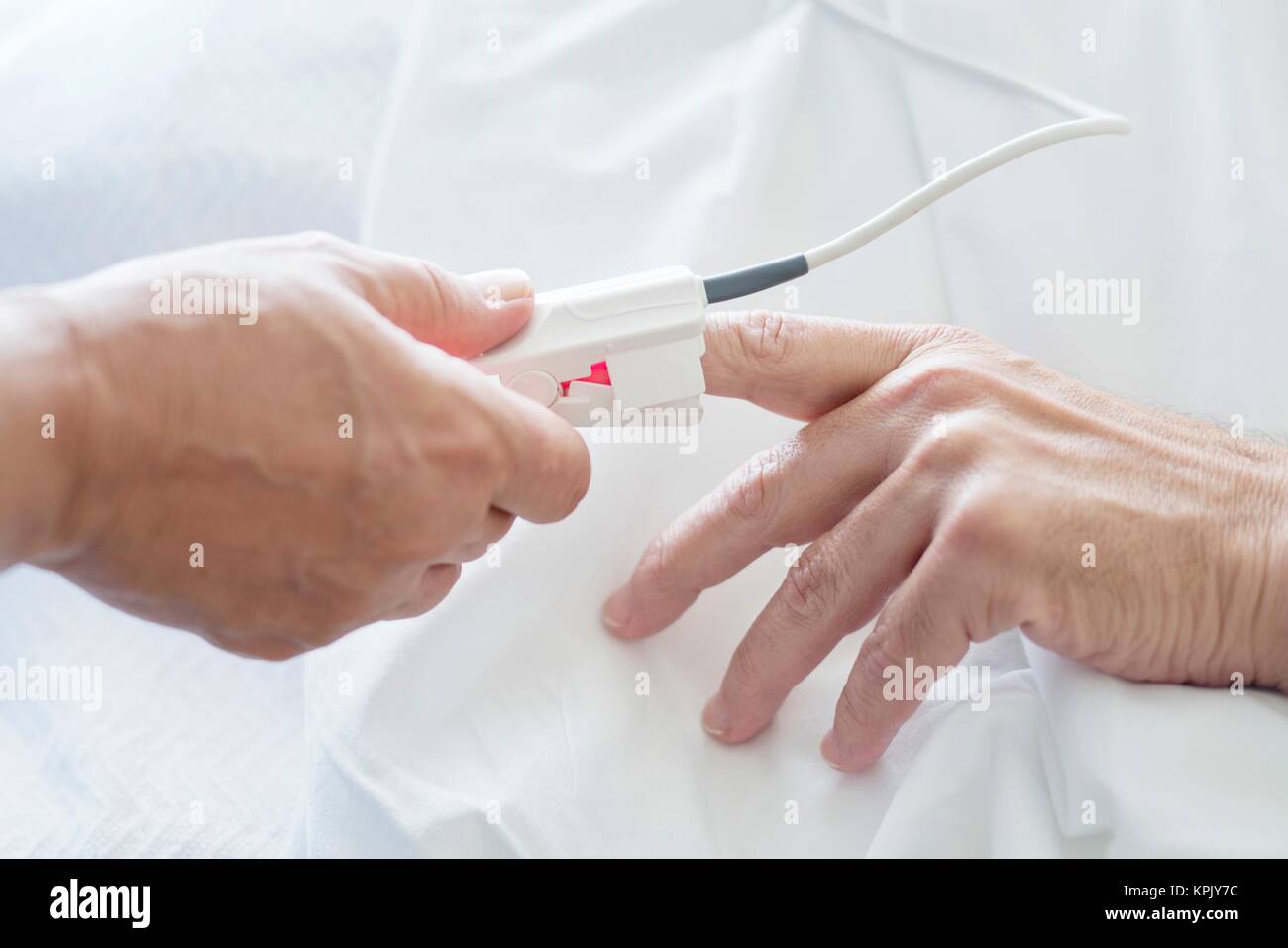 Mature man pulse oximeter hi-res stock photography and images - Alamy