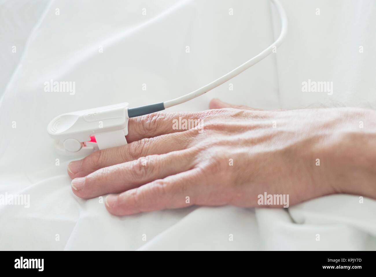 Mature man pulse oximeter hi-res stock photography and images - Alamy