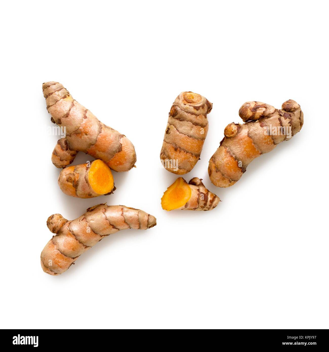 Turmeric root against a white background Stock Photo - Alamy