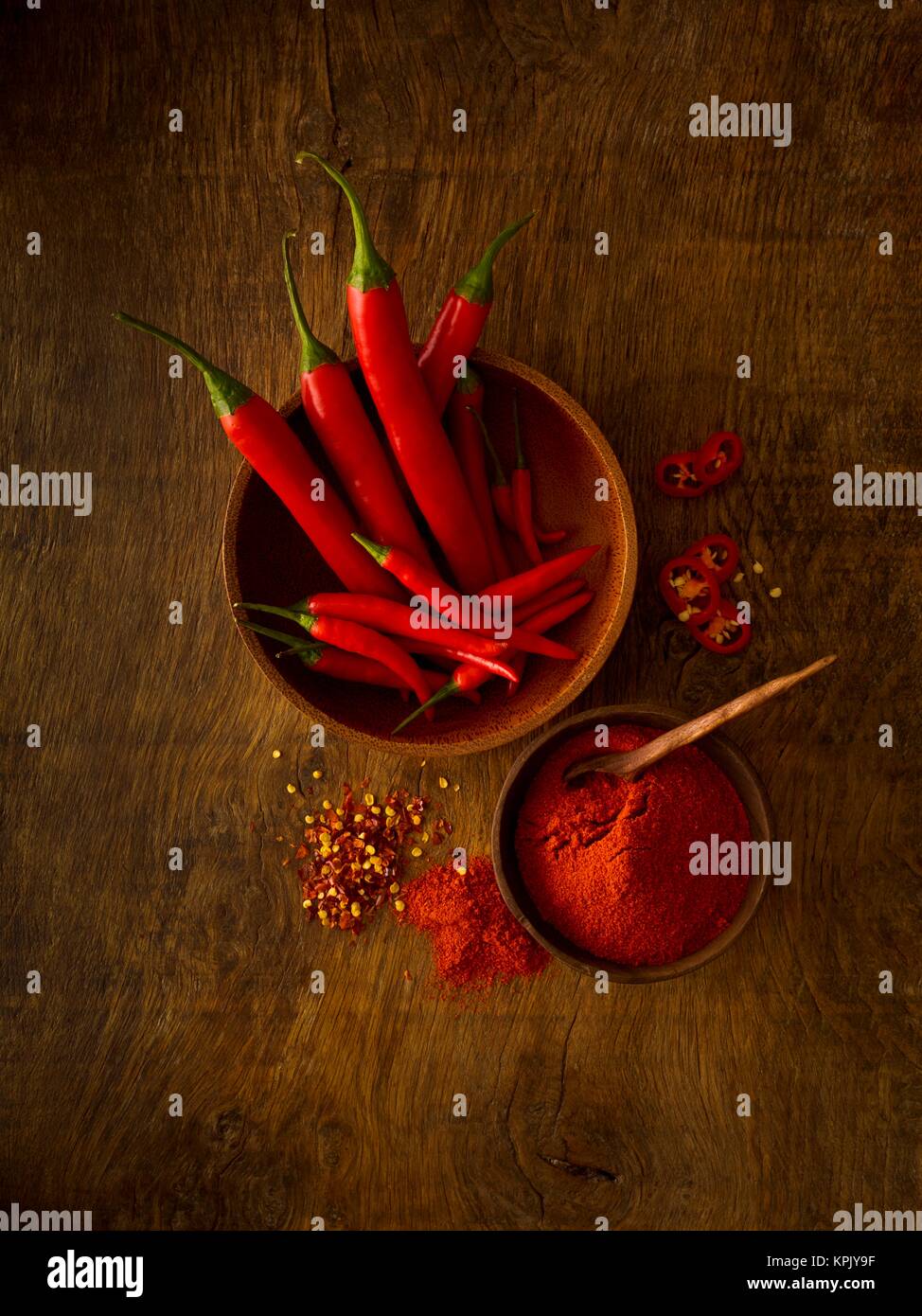 Fresh red chillies and powder, studio shot Stock Photo - Alamy