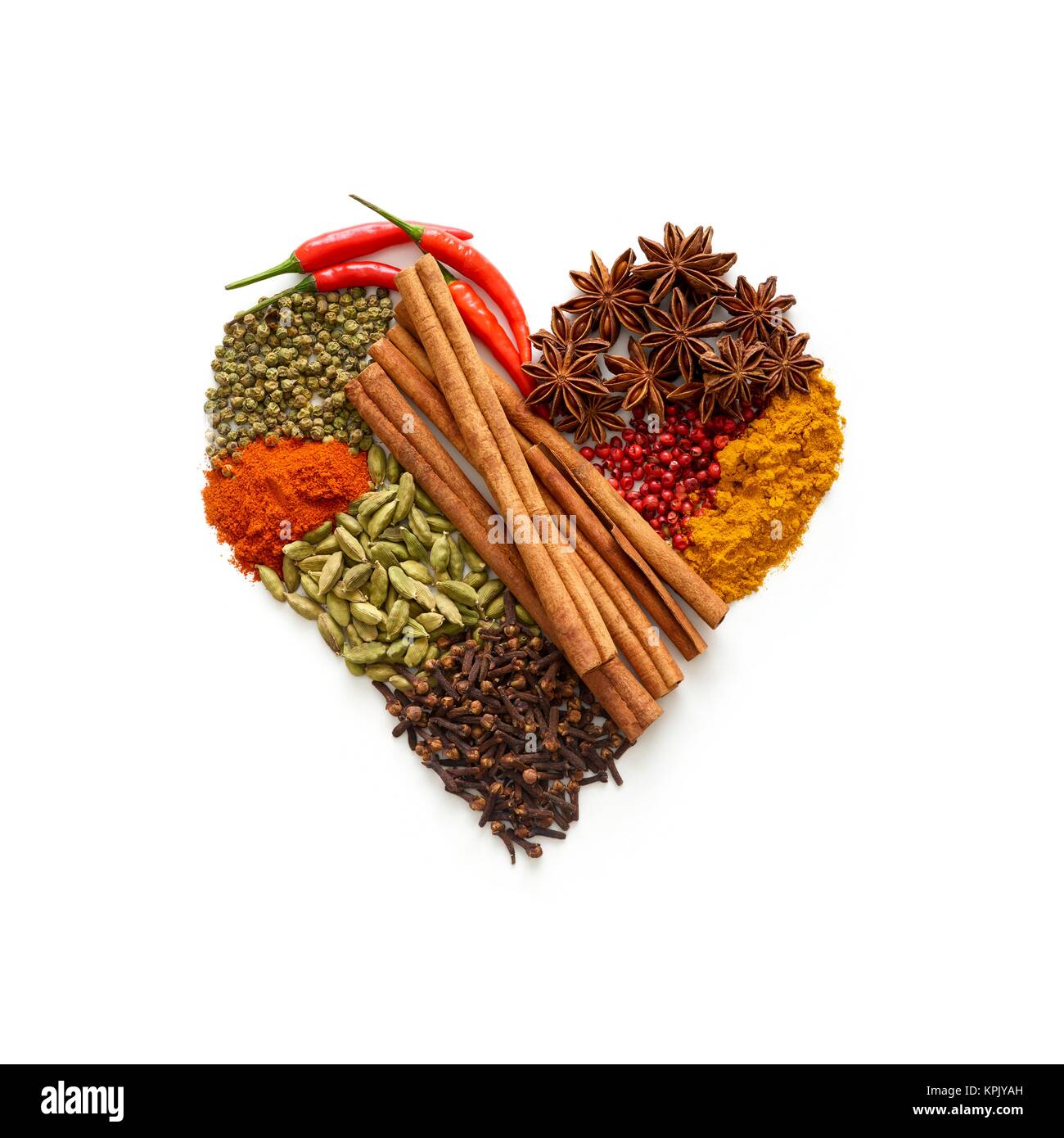 Dried spices in heart shape, studio shot Stock Photo - Alamy