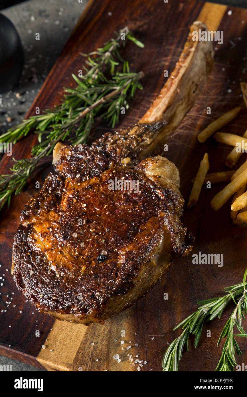 Cooked Grass Fed Tomahawk Steaks with Fries and Rosemary Stock Photo ...