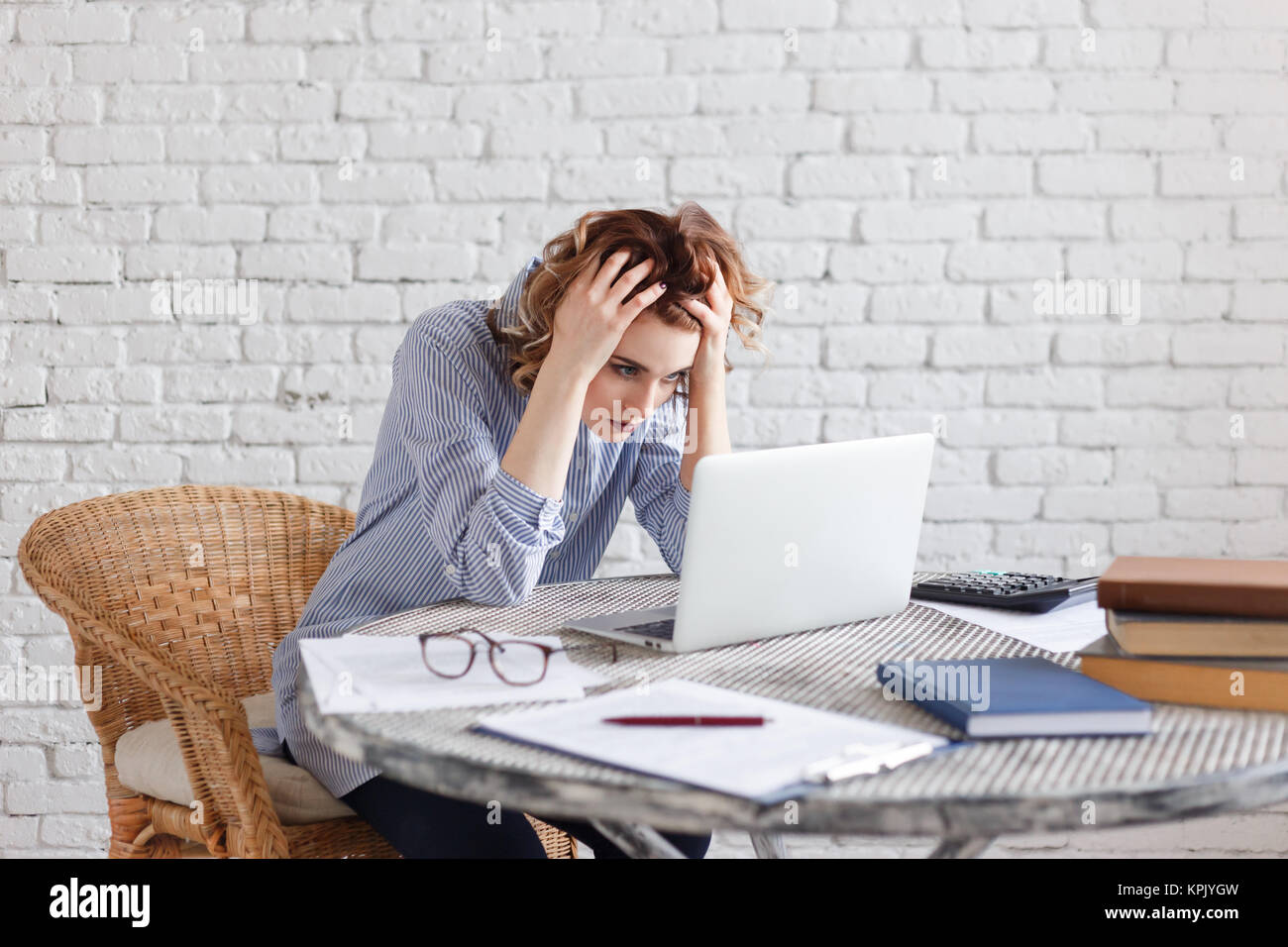 Portrait of tired young business woman with laptop computer Stock Photo ...
