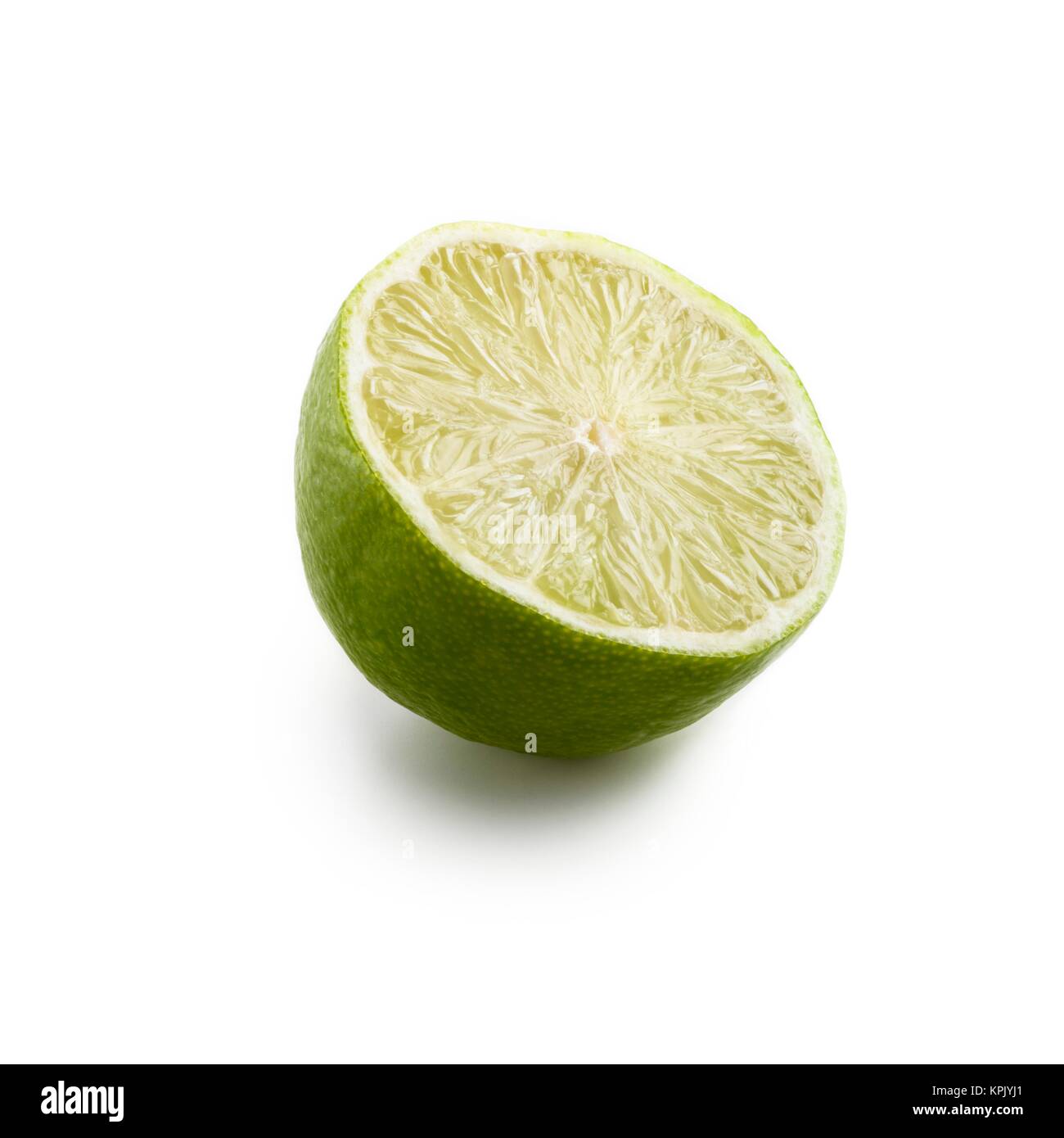 Half a lime against a white background Stock Photo - Alamy