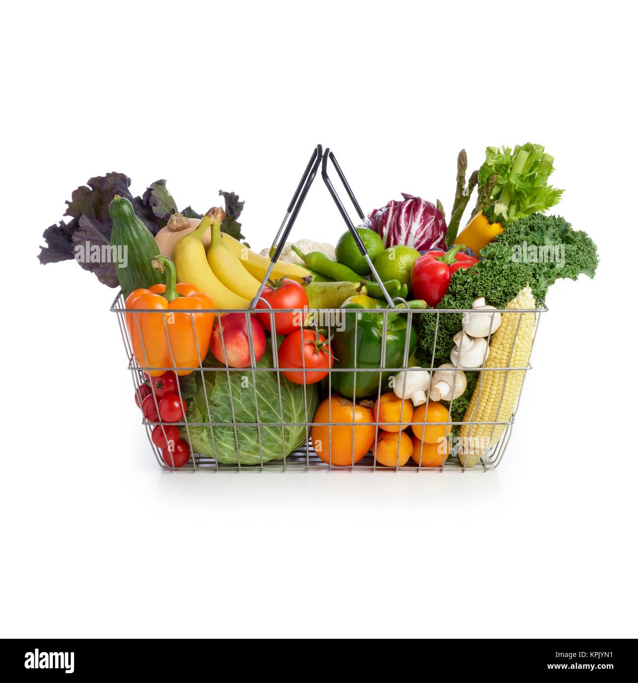 Shopping basket full of fresh produce against a white background Stock ...