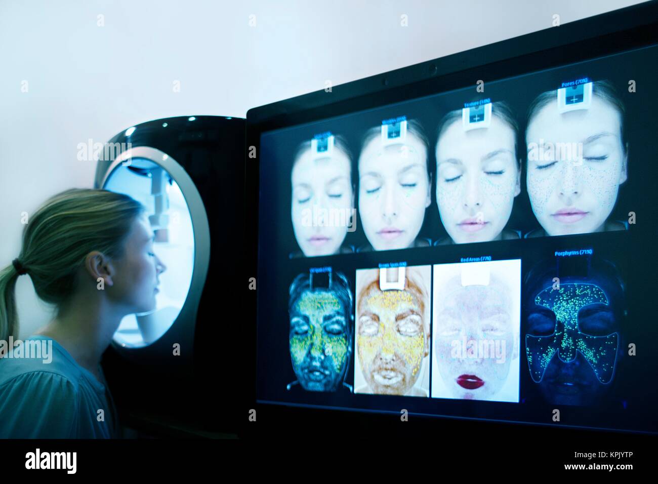 Young woman undergoing examination in skin clinic. This scan allows the ...