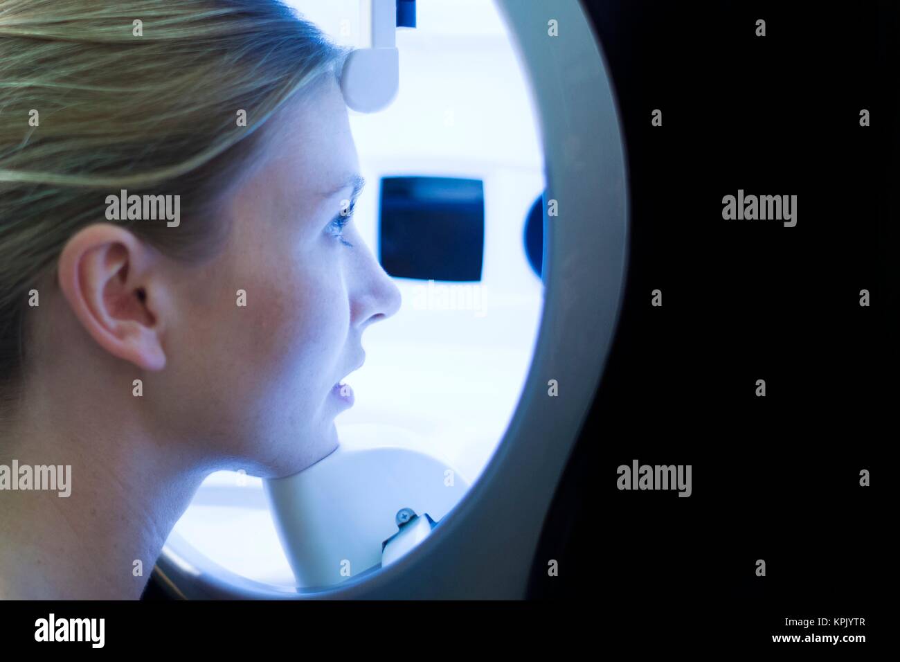 Young woman undergoing examination in skin clinic. This scan allows the ...