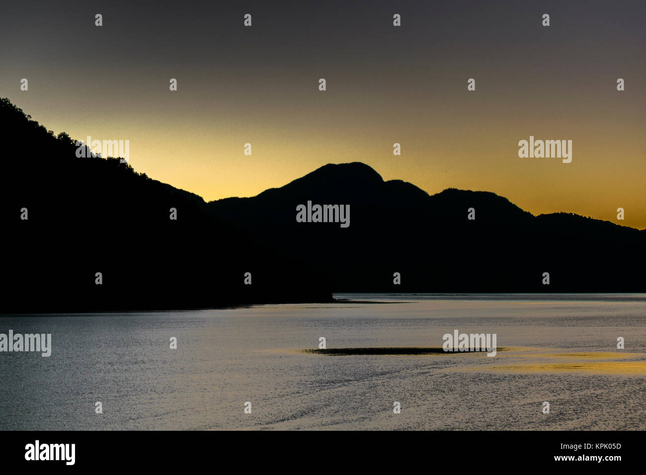Sunset silhouette andes mountains and lake landscape scene at Patagonia ...
