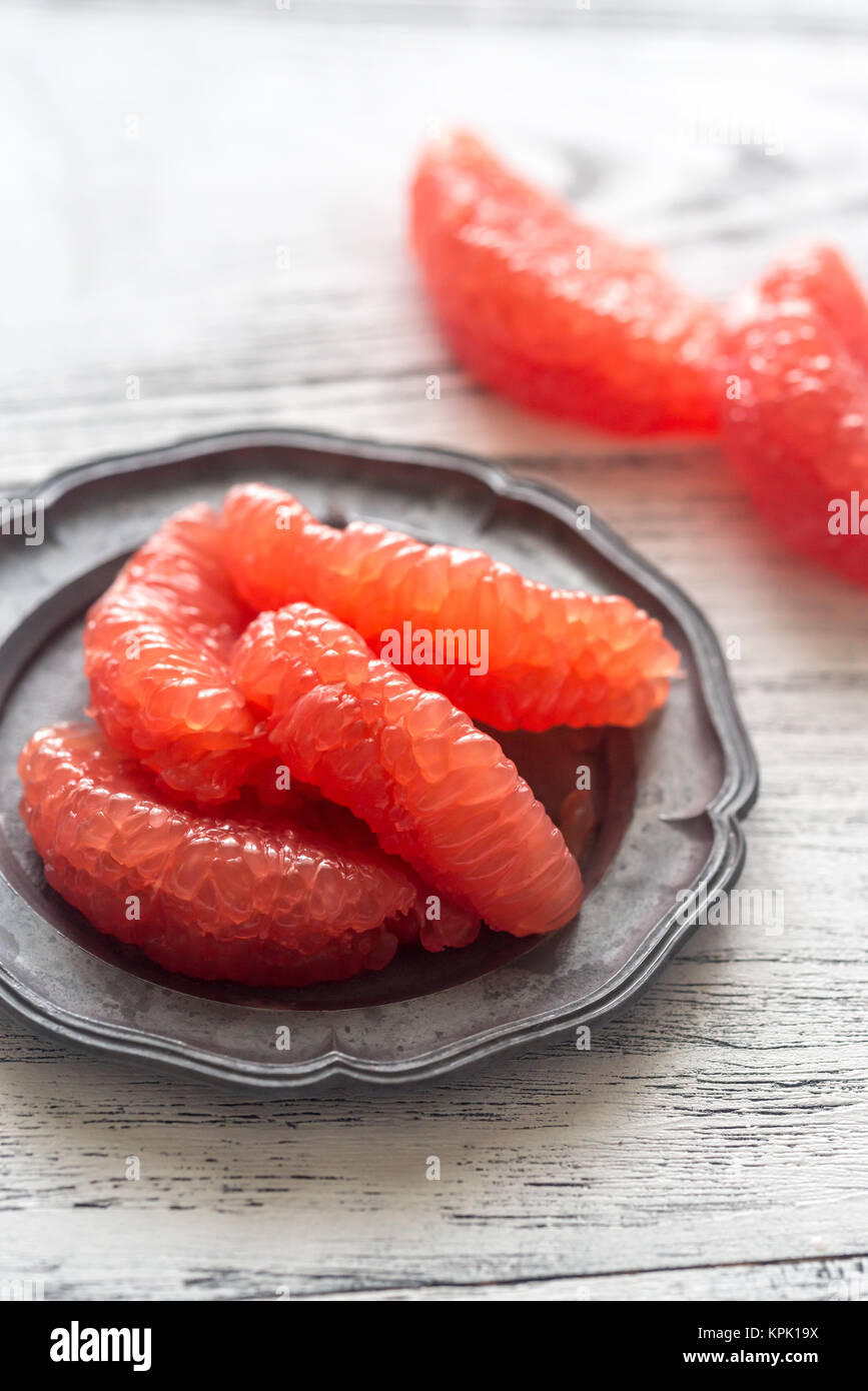 Peeled grapefruit on the table Stock Photo - Alamy