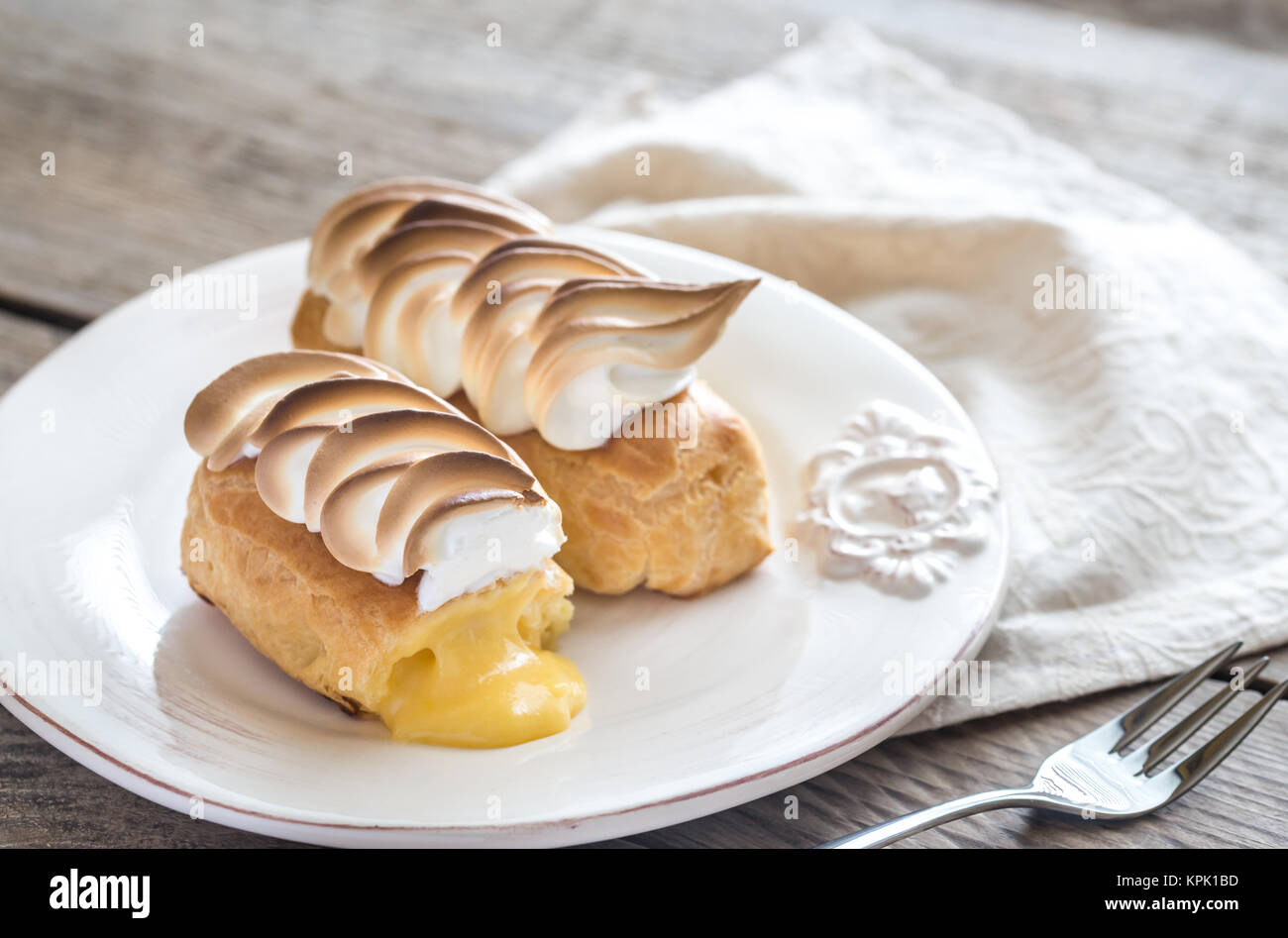 Eclairs with lemon curd and meringue Stock Photo - Alamy