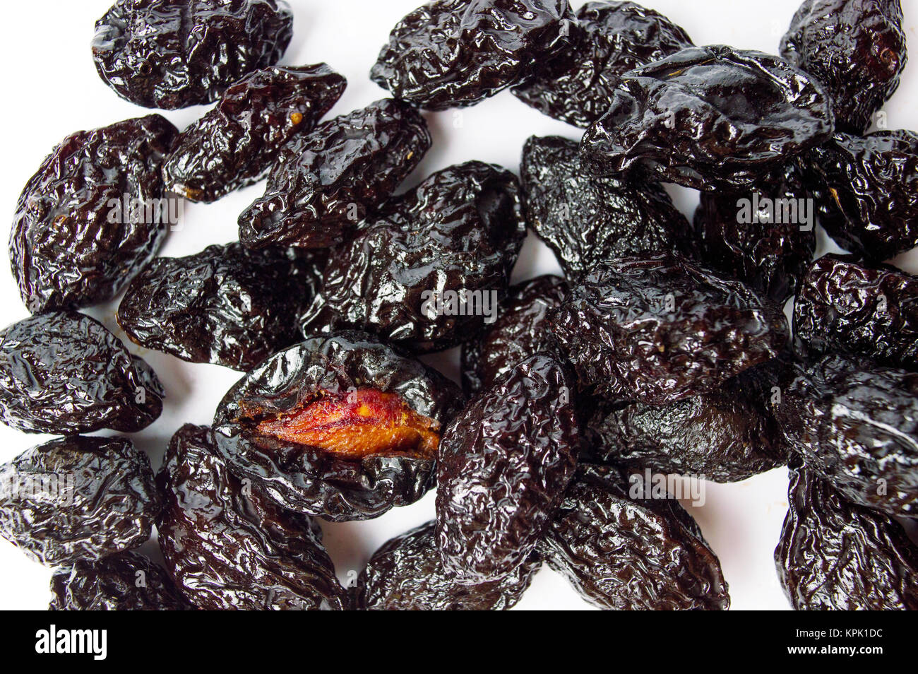 Dried plum fruits on white background isolated Stock Photo - Alamy