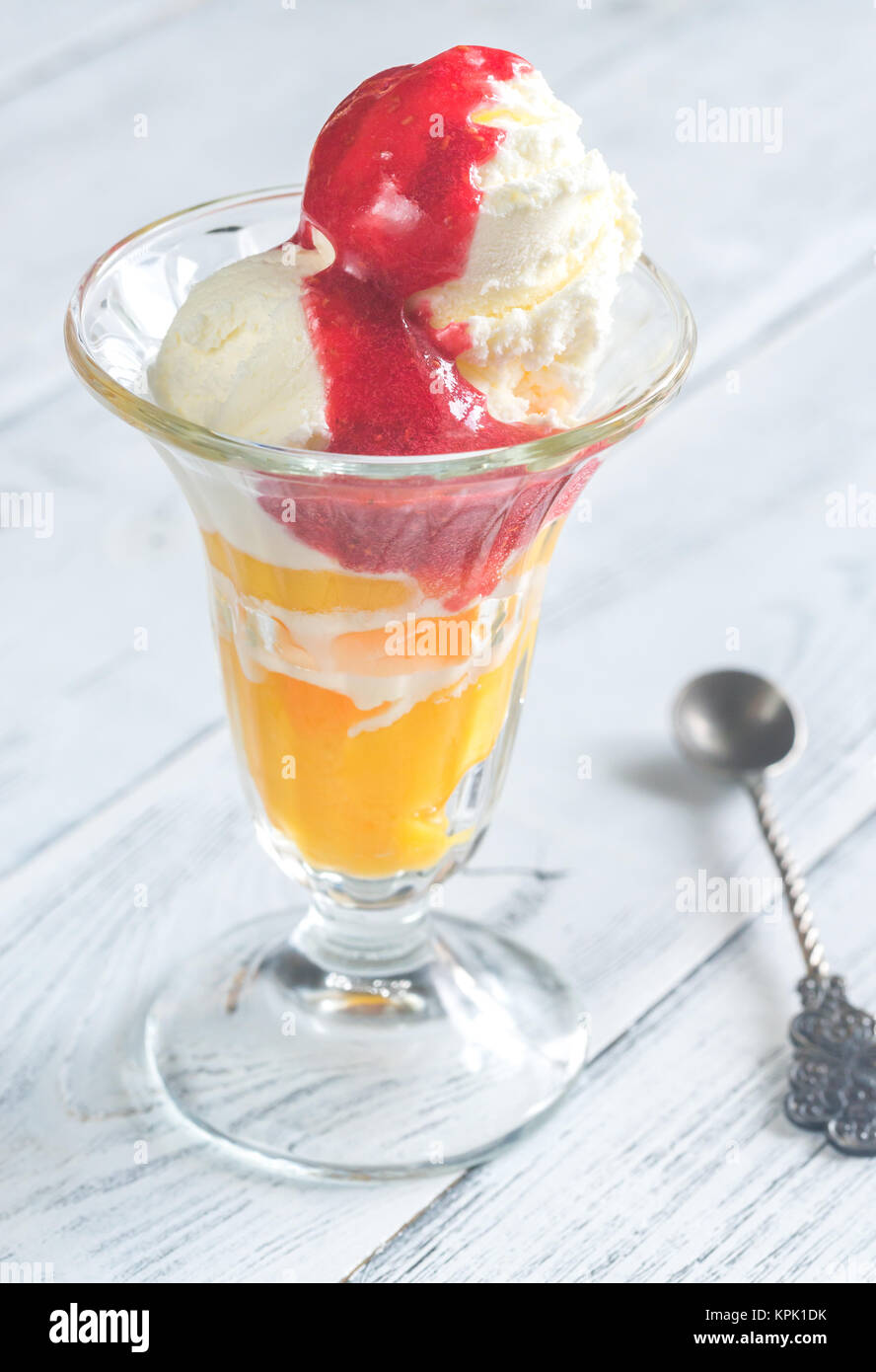 Bowl of Peach Melba - vanilla ice cream with peaches and raspberry ...