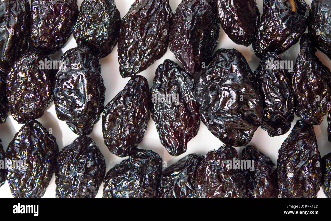 Dried plum fruits on white background isolated Stock Photo - Alamy