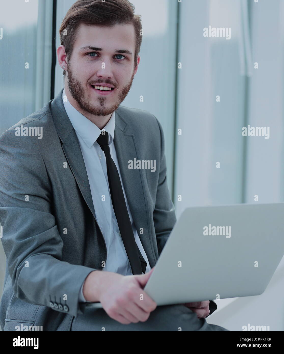 Happy young business man work in modern office on computer Stock Photo ...