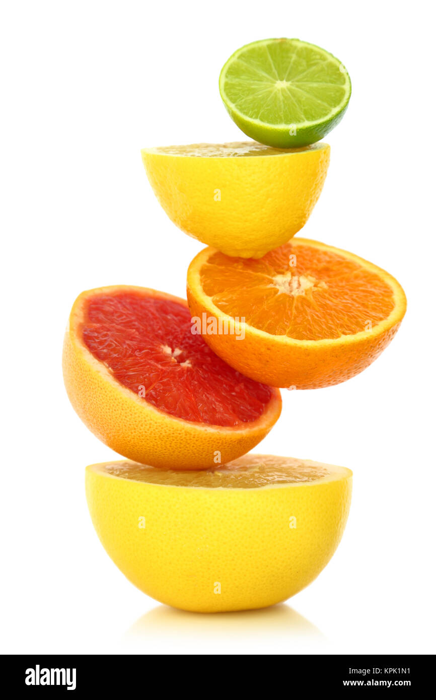 Fresh citrus fruit in a row on white background Stock Photo - Alamy