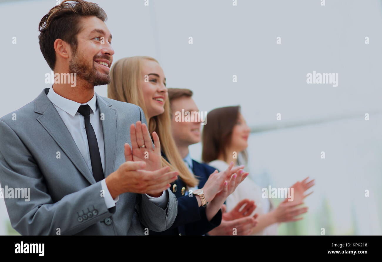 Satisfied proud business team clapping hands Stock Photo - Alamy