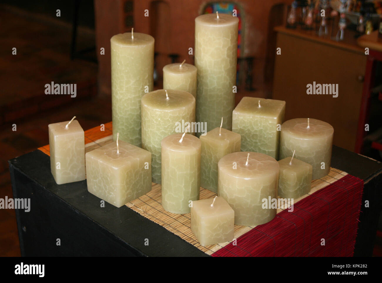 Rectangular cube and cylindrical shaped scented candles on display ...