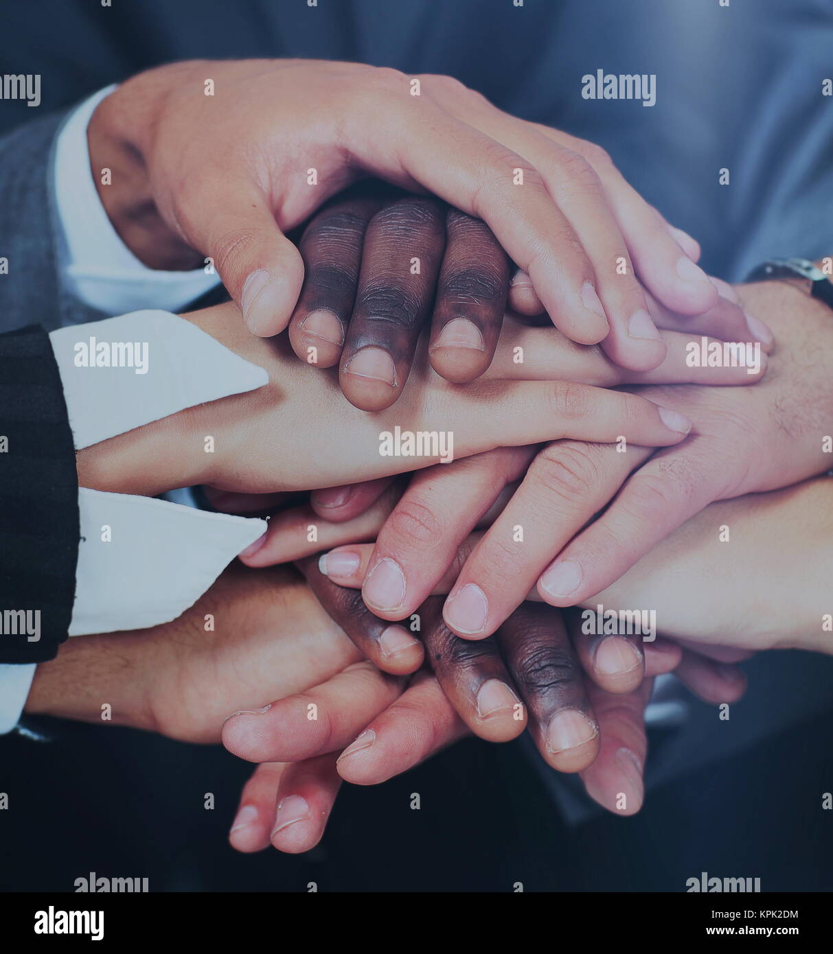 people putting their hands together, focus on hands Stock Photo - Alamy