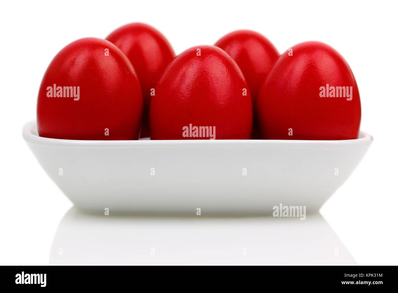 Red Easter eggs in a bοwl Stock Photo - Alamy