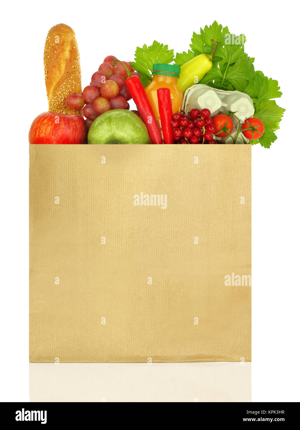 Paper bag full of groceries isolated on white Stock Photo - Alamy