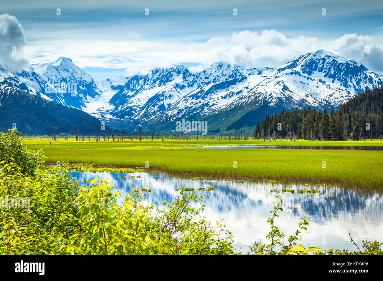 Reflection of Chugach Mountains in a tranquil lake; Alaska, United ...