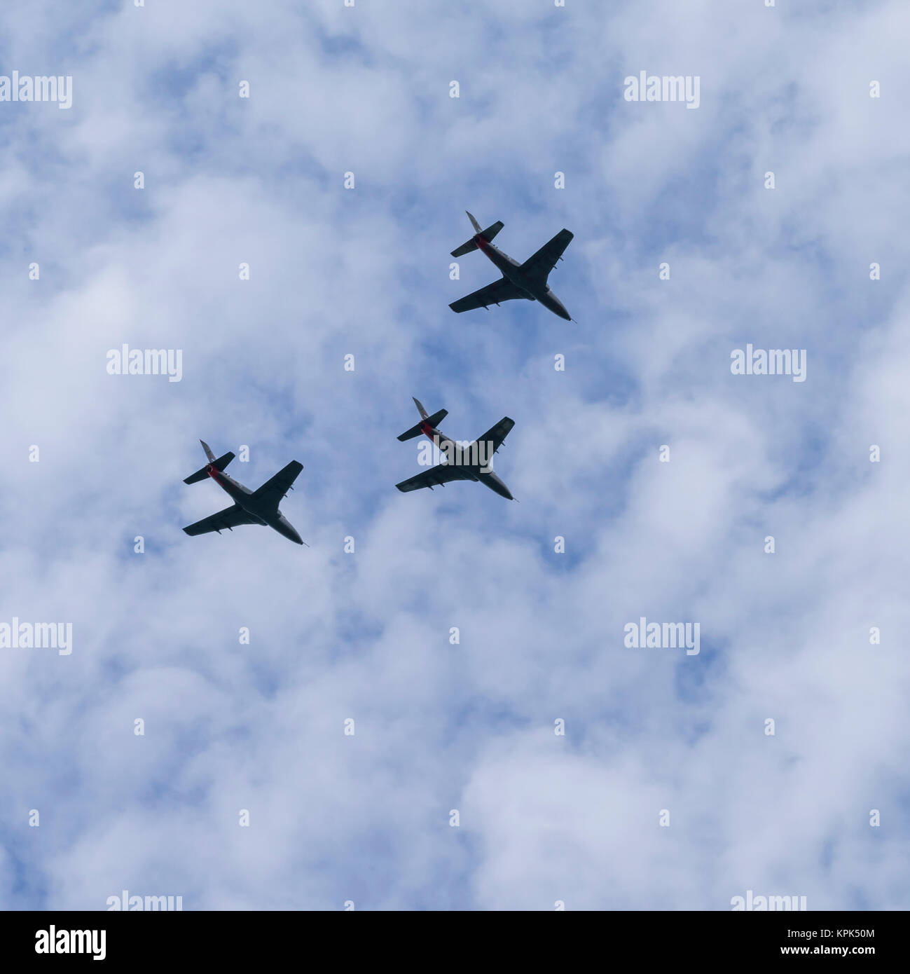 Three planes flying in formation in a blue sky with cloud over Belgrade ...