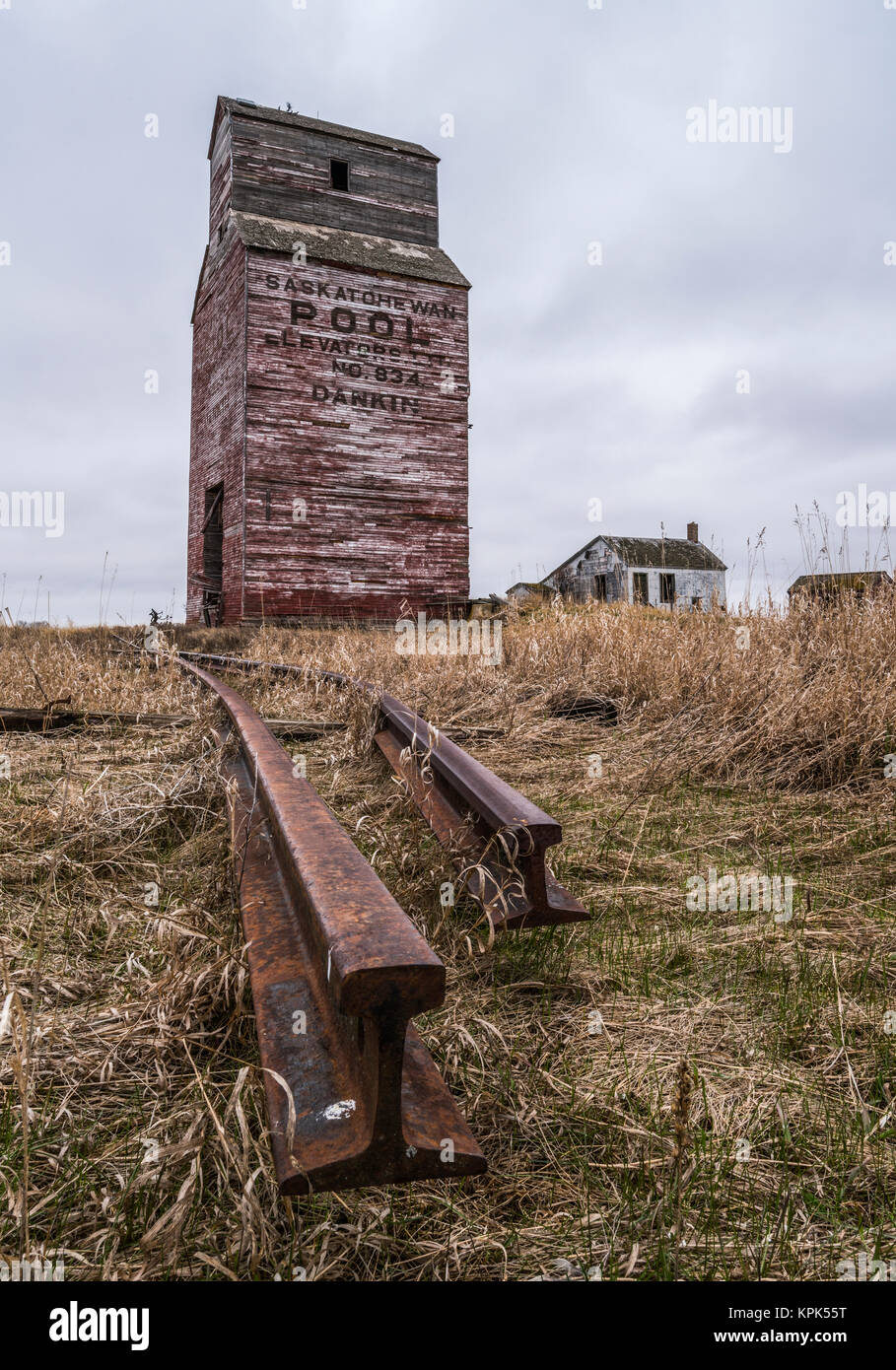 Abandoned grain elevator with rusted railroad tracks in rural ... Abandoned grain elevator with rusted railroad tracks in rural ...