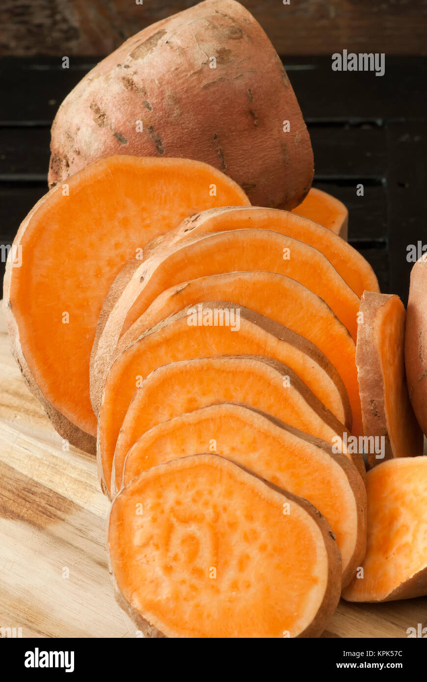 Sliced raw sweet potato Stock Photo - Alamy