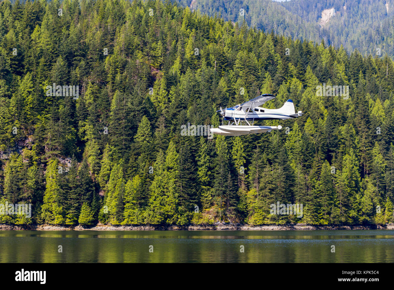 A float plane travels low above the ocean on a scenic tour of the ...
