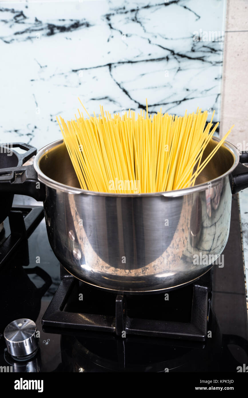 Pasta inside a pot ready to be cooked Stock Photo - Alamy