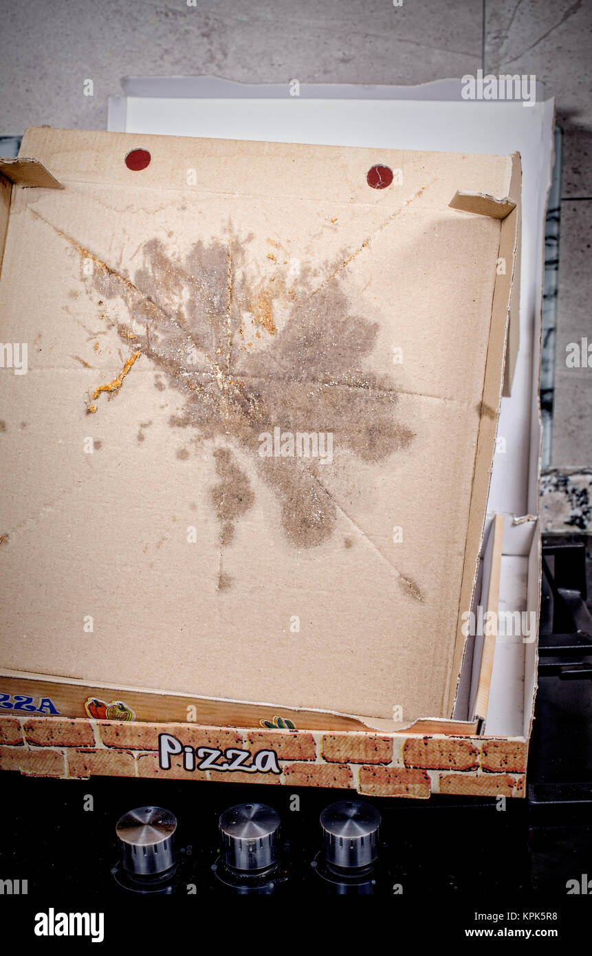 Empty pizza box with grease stains, a fast food concept Stock Photo - Alamy