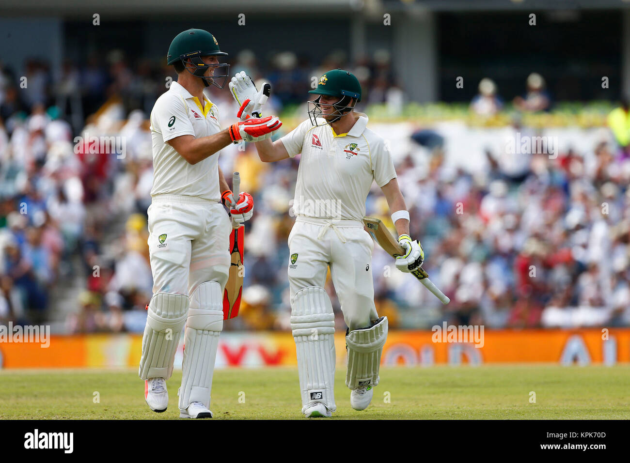 Australia's Mitchell Marsh walks off at tea with Steve Smith during day ...