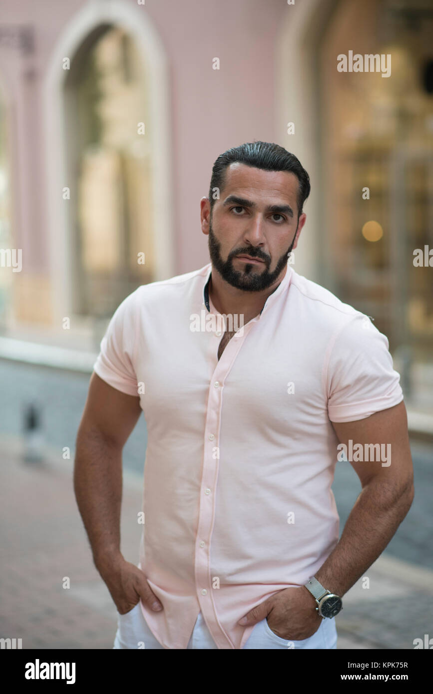 Portrait of a serious man staring outdoors Stock Photo - Alamy