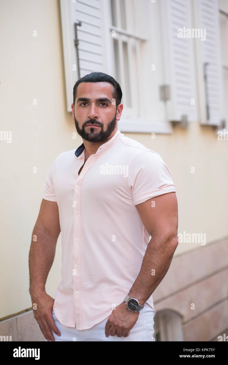 Handsome man standing outdoors Stock Photo - Alamy