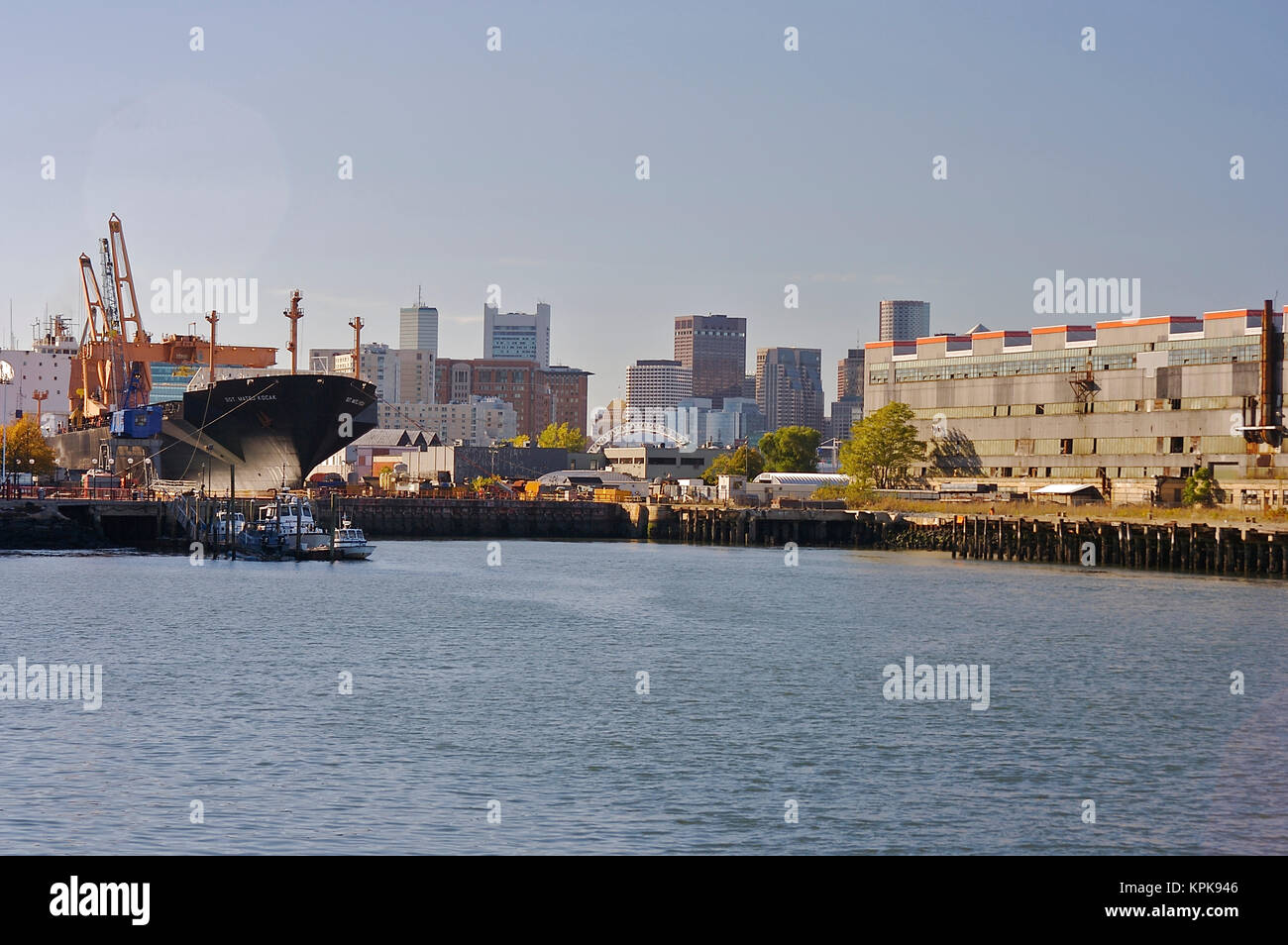 USA, Massachusetts, Boston. Industrial buildings and boats on Boston ...