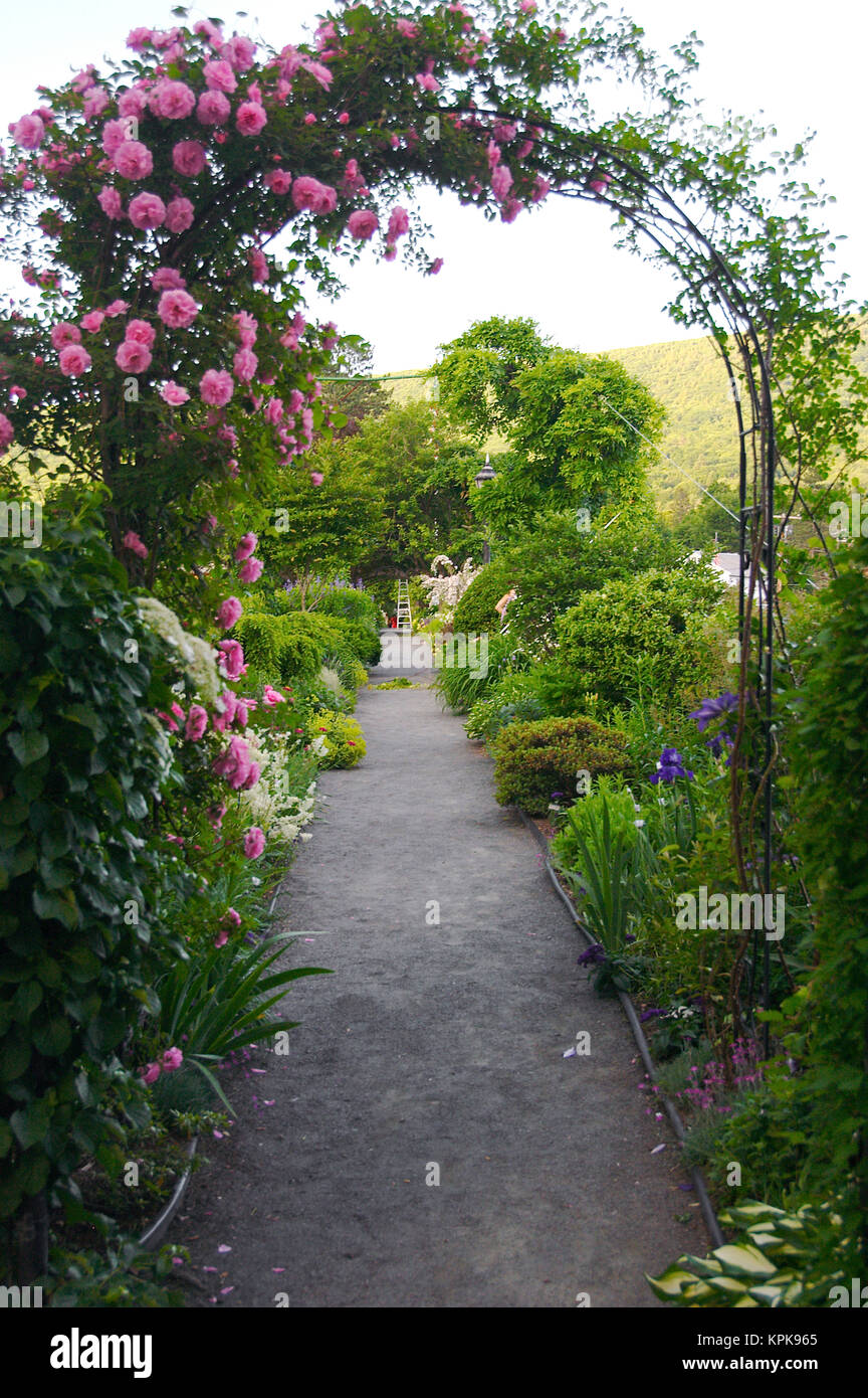 USA, Massachusetts, Shelburne Falls. A flowery trellis frames the ...