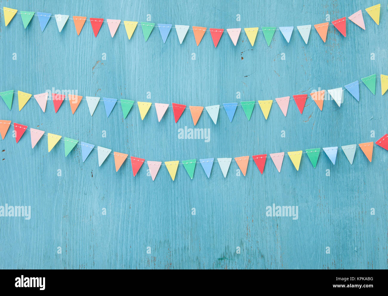 colorful garland on blue Stock Photo - Alamy