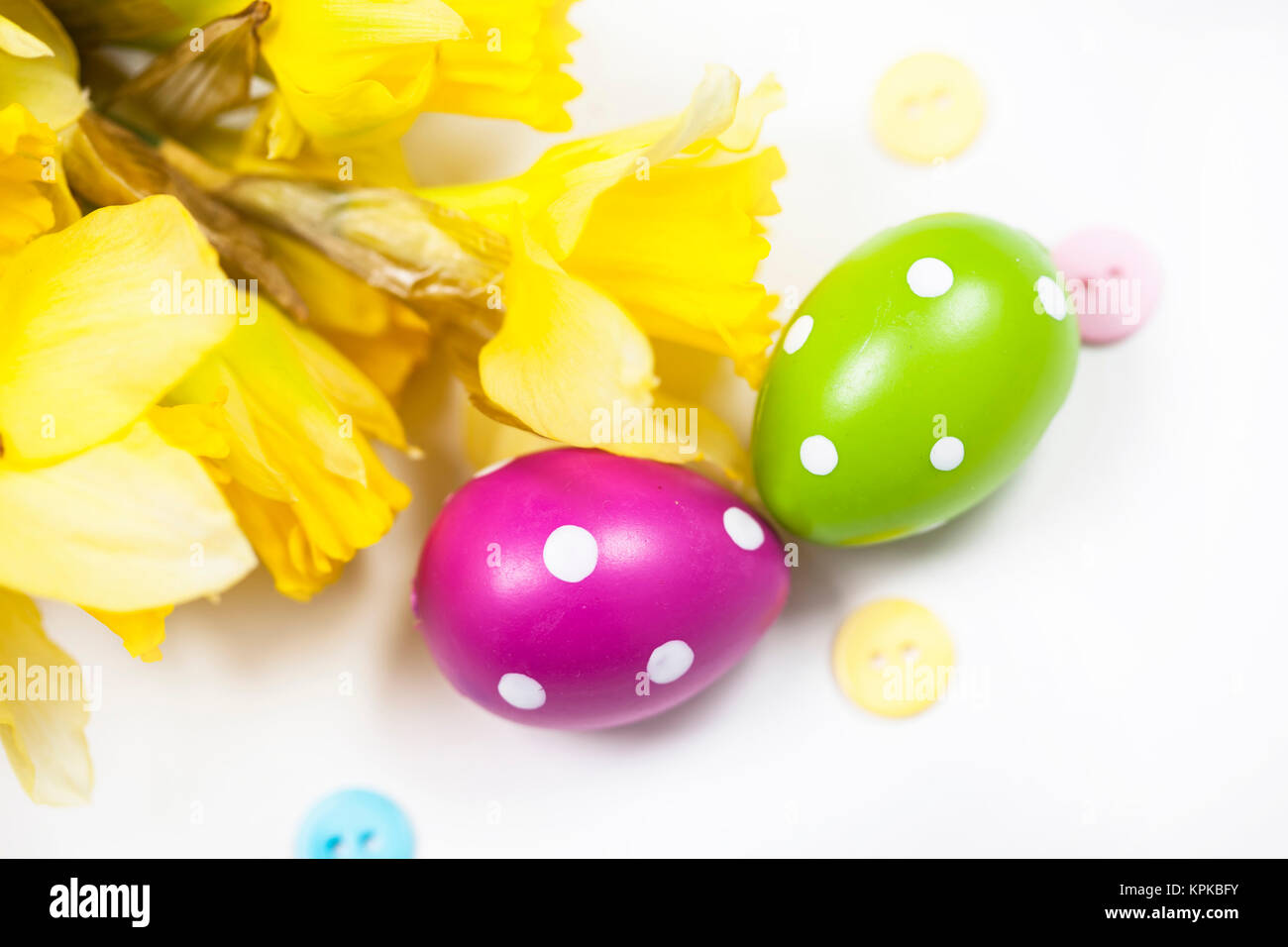 Easter background with colorful Easter eggs and a bouquet of yellow ...