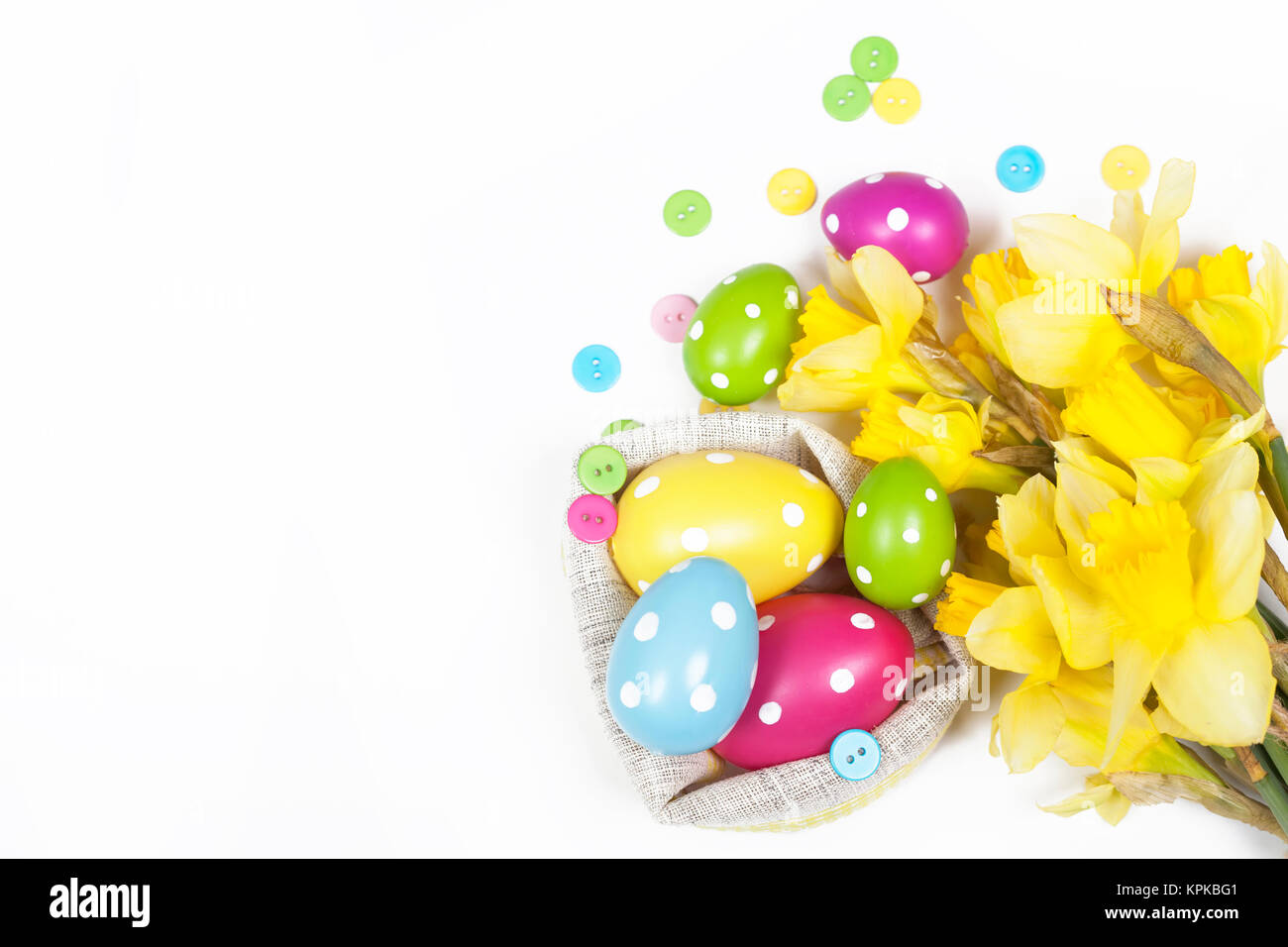 Easter background with colorful Easter eggs and a bouquet of yellow ...