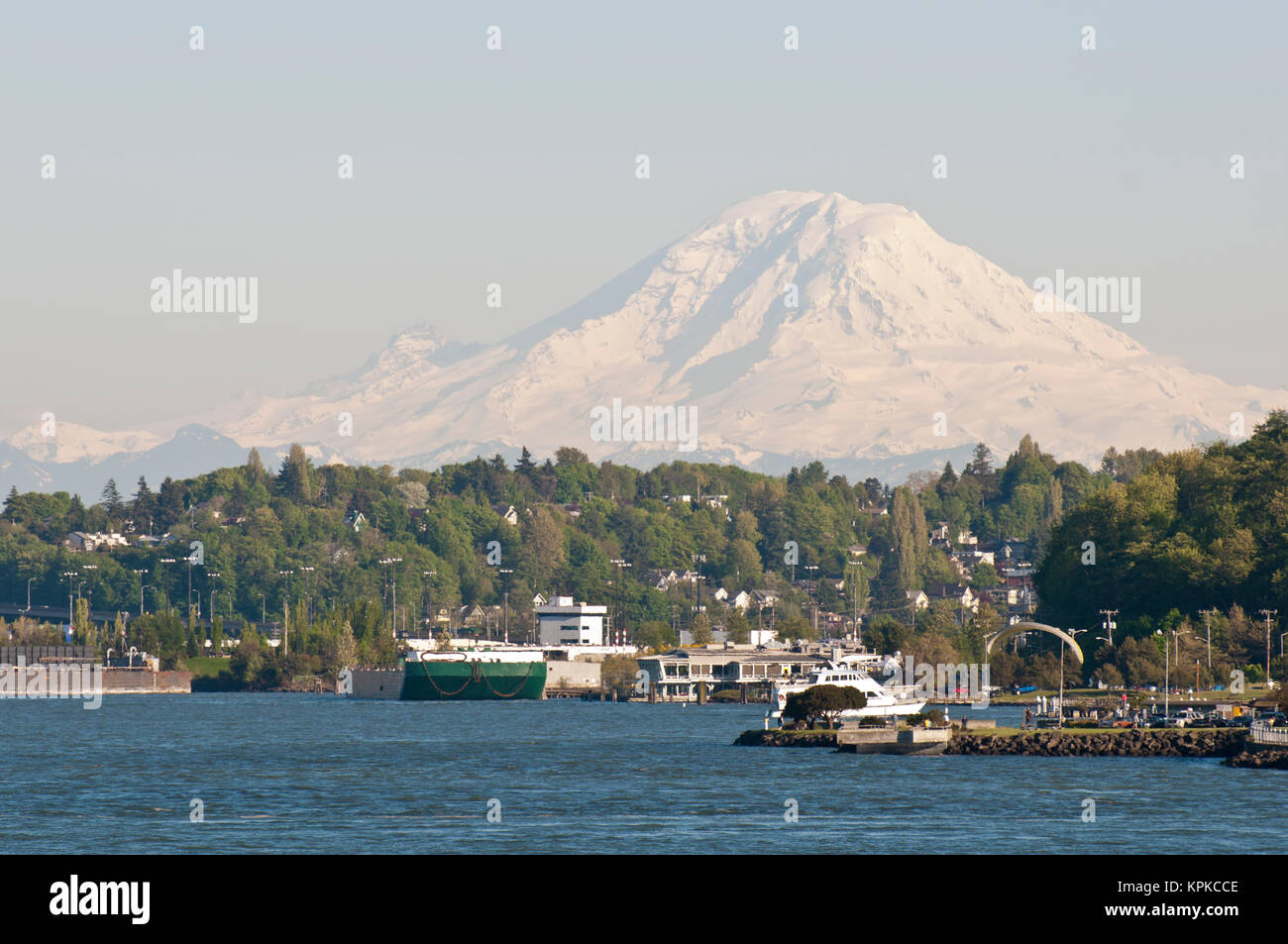 US, WA, West Seattle. Water taxi approaches Seacrest Dock. Mount ...
