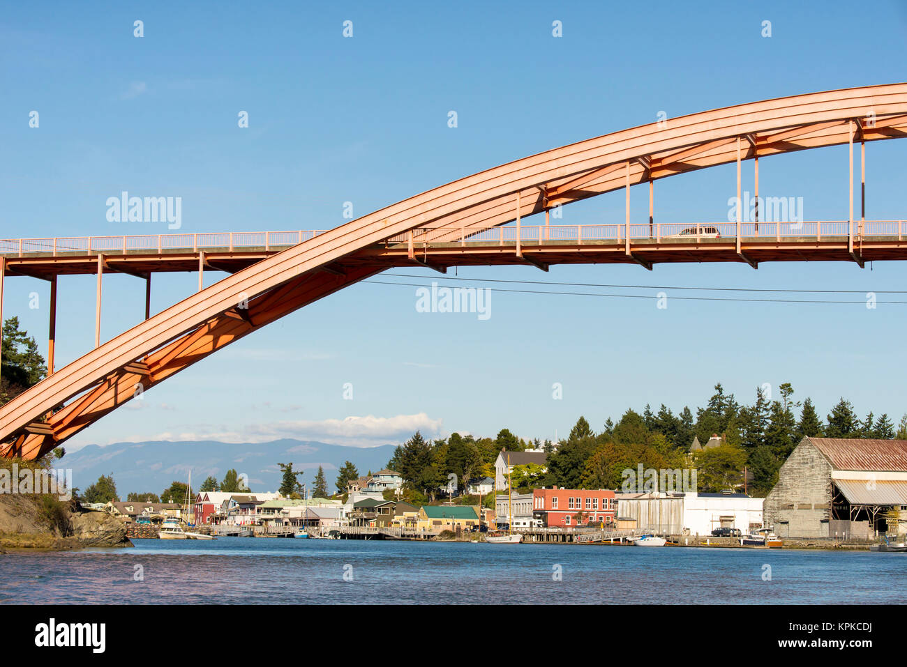 US, WA, La Conner. Rainbow Bridge frames entrance to town on Swinomish ...