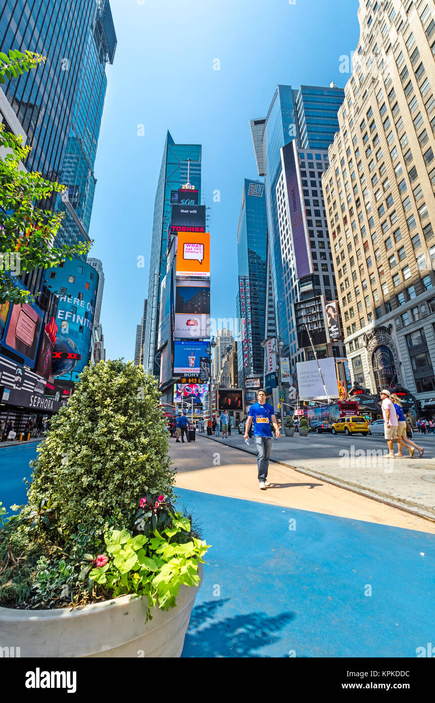 NEW YORK CITY - JULY 12: Undefined people pass through Times Square on ...
