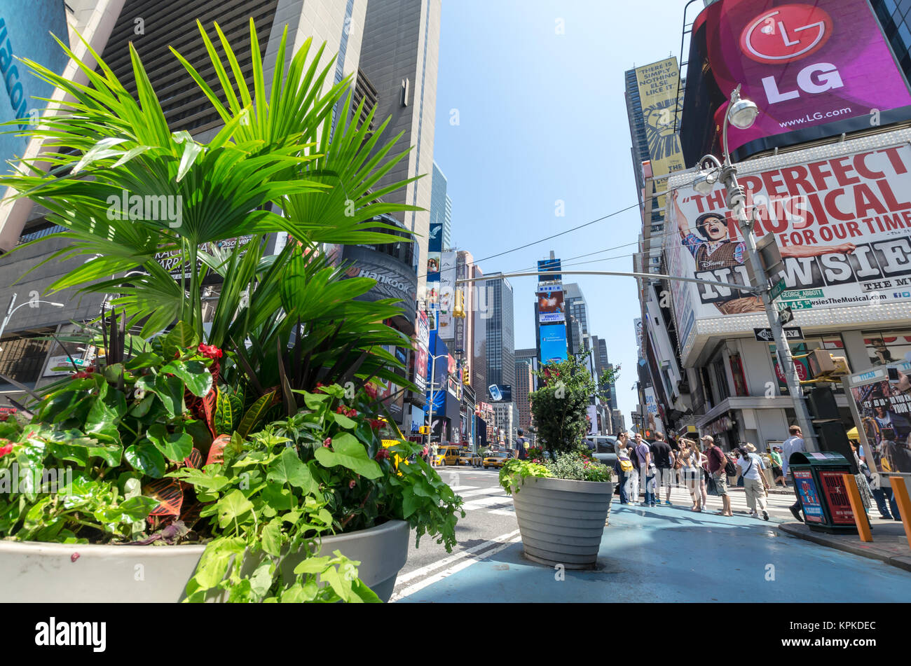 NEW YORK CITY - JULY 12: Undefined people pass through Times Square on ...