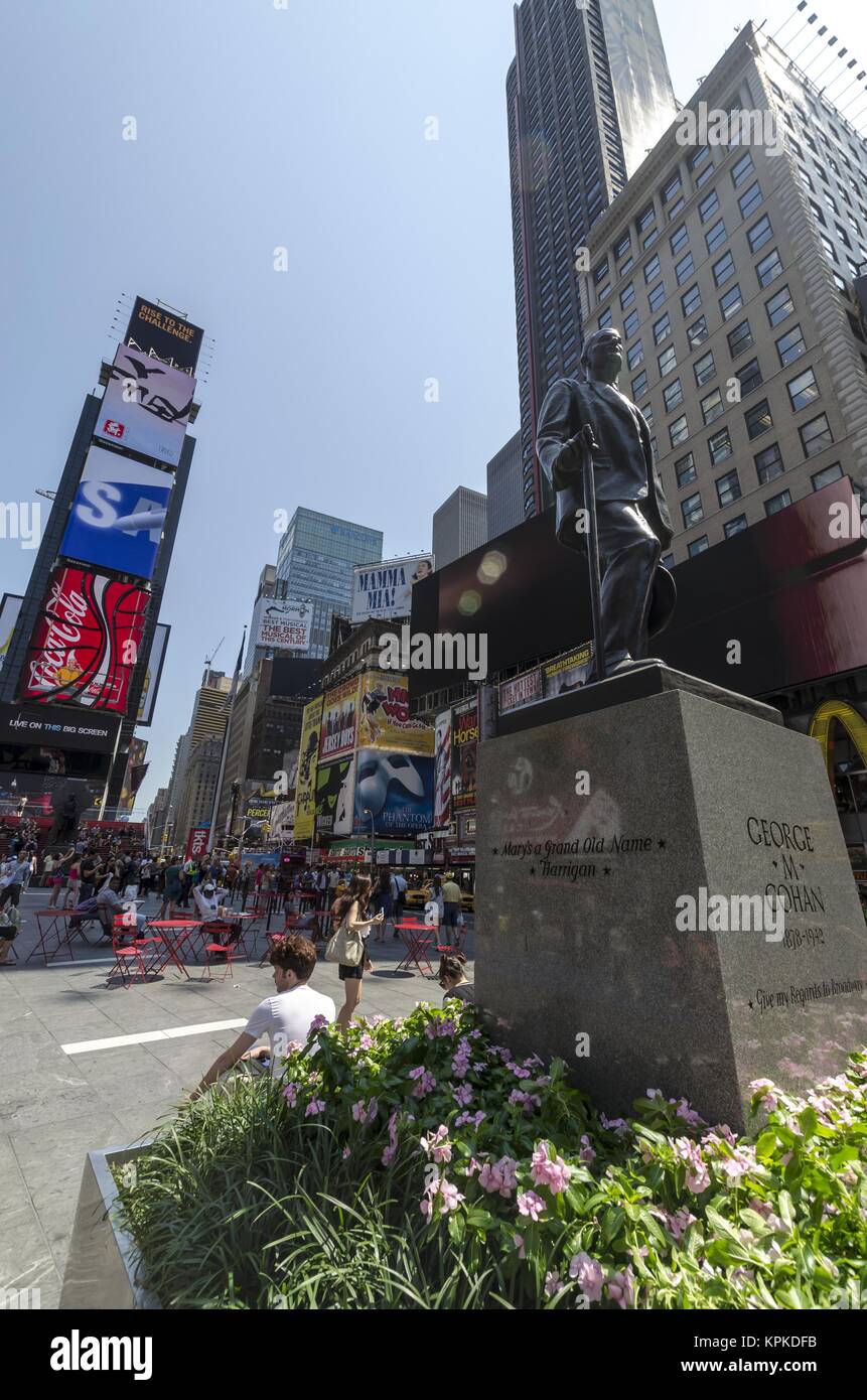 NEW YORK CITY - JULY 12: People sit in outdoor cafe at Times Square on ...